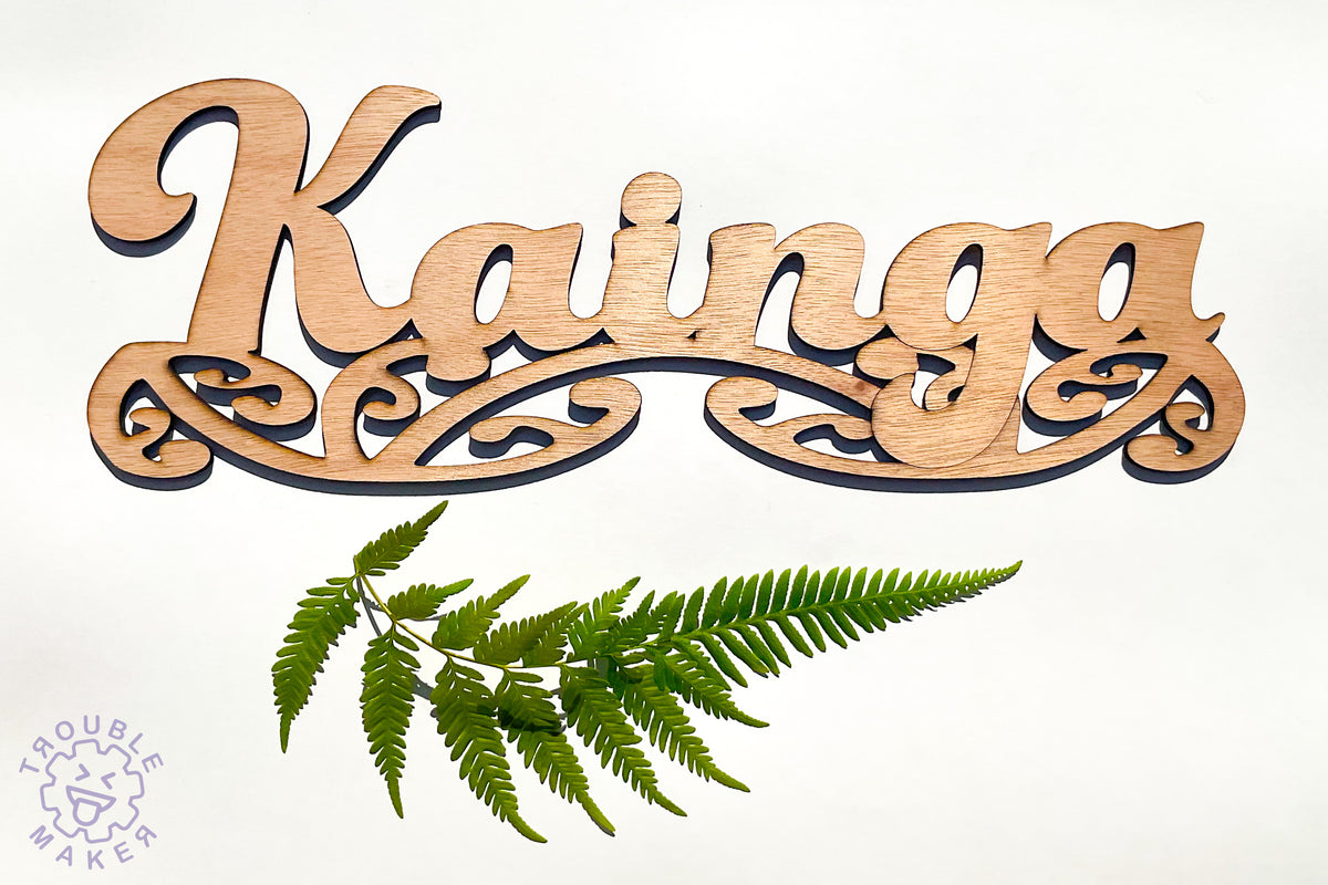 Kainga sign art, carved of wood– TroubleMaker.co.nz